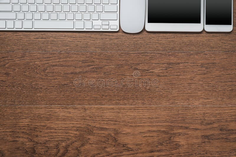 Office Wooden Table with Tablet, Keyboard, Mouse and Smartphone Stock ...