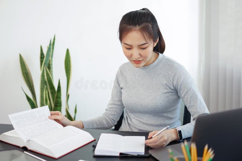 Office Work Concept a Female Secretary Writing Some Information into a ...