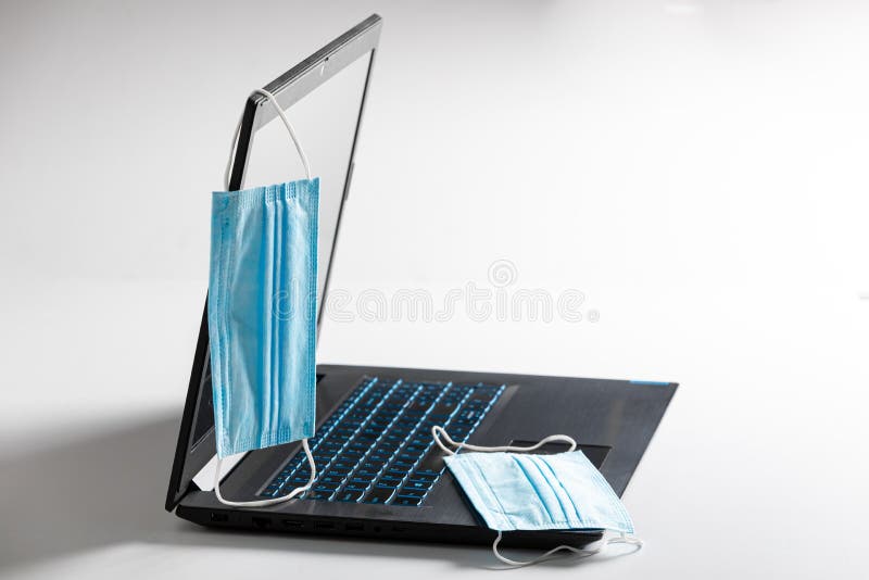 Office Work from Home in Pandemic. Protective Mask on Keyboard Stock ...