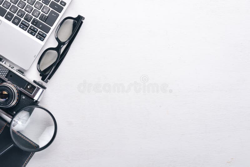 Office Work Space with Camera, Notebook, Eyepieces, and Pen. on a ...