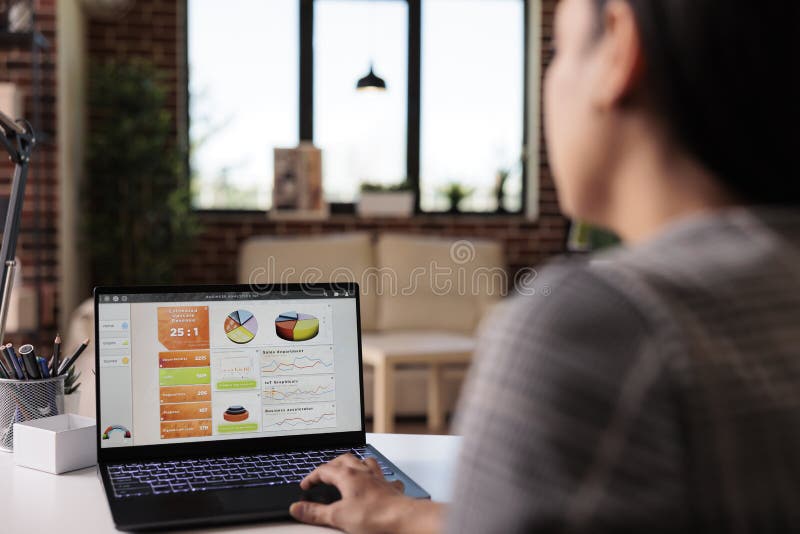 Office Worker Analyzing Business Charts on Laptop Stock Photo - Image ...