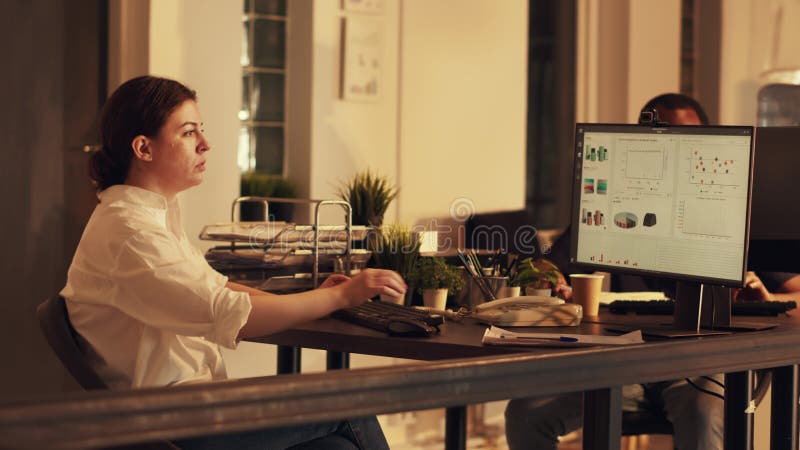 Office Worker Analyzing Diagrams and Charts on Computer Stock Footage ...