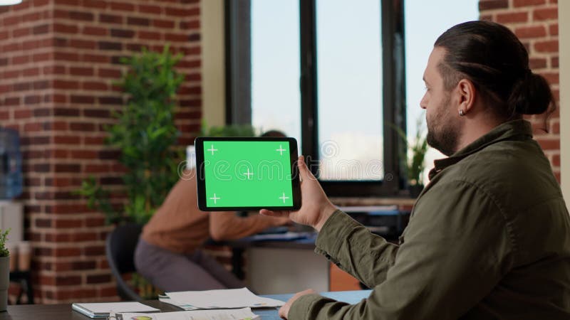 Office Worker Analyzing Horizontal Greenscreen on Tablet Stock Video ...