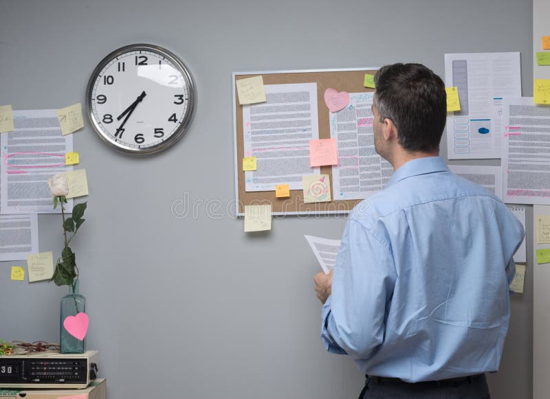 Office Worker Checking Notes on Pin Board Stock Image - Image of note ...
