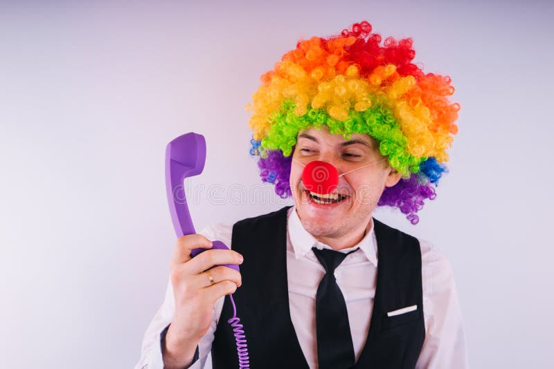 Office Worker in Clown Wig, Clown Concept at Work. Businessman with ...
