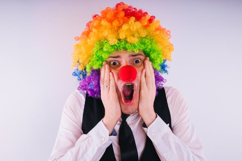 Office Worker in Clown Wig, Clown Concept at Work. Businessman with ...
