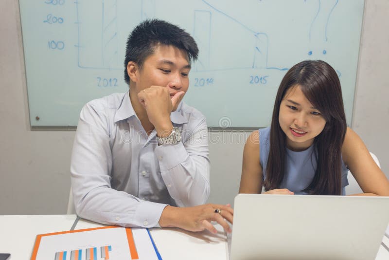 Office Worker Discuss about Financial Number on Laptop Stock Image ...