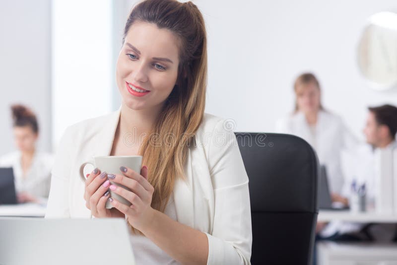 Office worker drinking tea stock image. Image of businessperson - 63404795