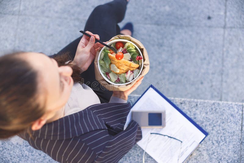 Office Worker Eating Salad Outdoor. Top View. Stock Image - Image of ...