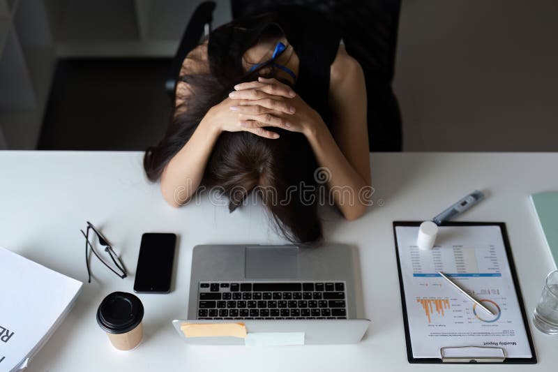 Stressed Office Worker Overwhelmed with Workload at Desk in Modern ...