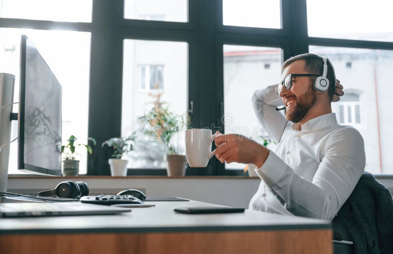 Office Worker in Formal Clothes is Sitting by Computer and Working ...