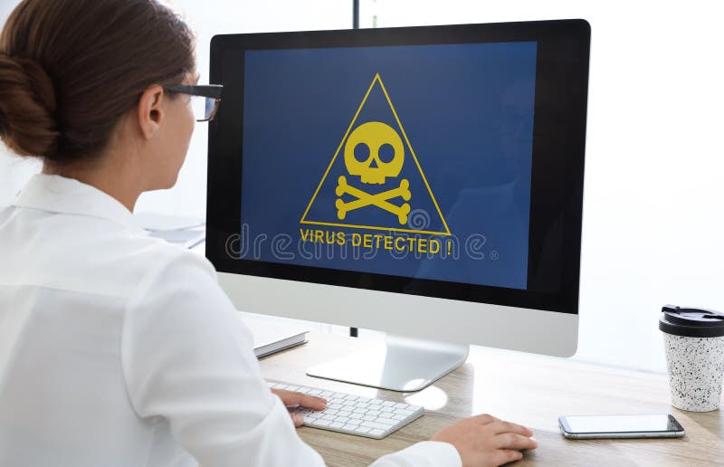 Office Worker in Front of Computer with Warning about Virus Attack on ...