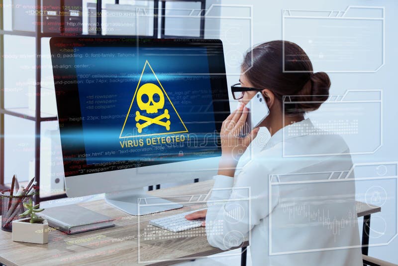 Office Worker in Front of Computer with Warning about Virus Attack on ...