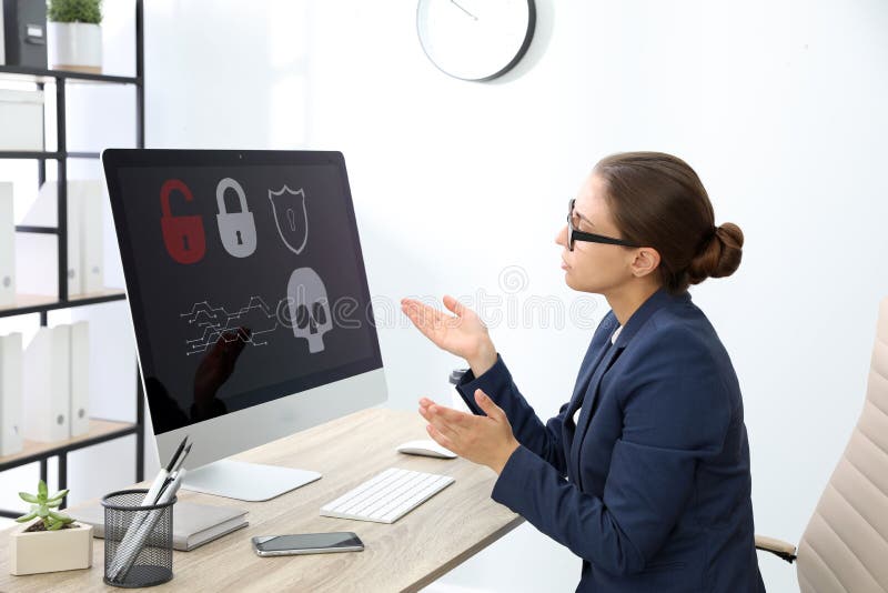 Office Worker in Front of Computer with Warning about Virus Attack on ...
