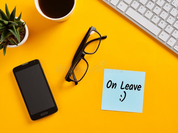 Office Worker Going on Leave, Writing a Note on Yellow Desk Stock Photo ...