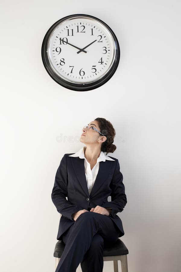 Office Worker Looking at Clock Stock Photo - Image of beautiful, camera ...