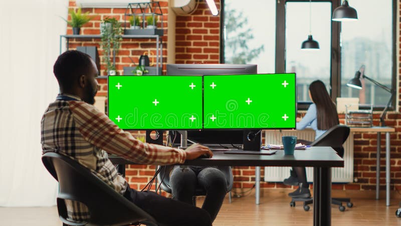 Office Worker Looking at Greenscreen Template on Computer Stock Photo ...