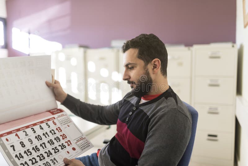 Office Worker Looking His Work Calendar Stock Image - Image of calendar ...
