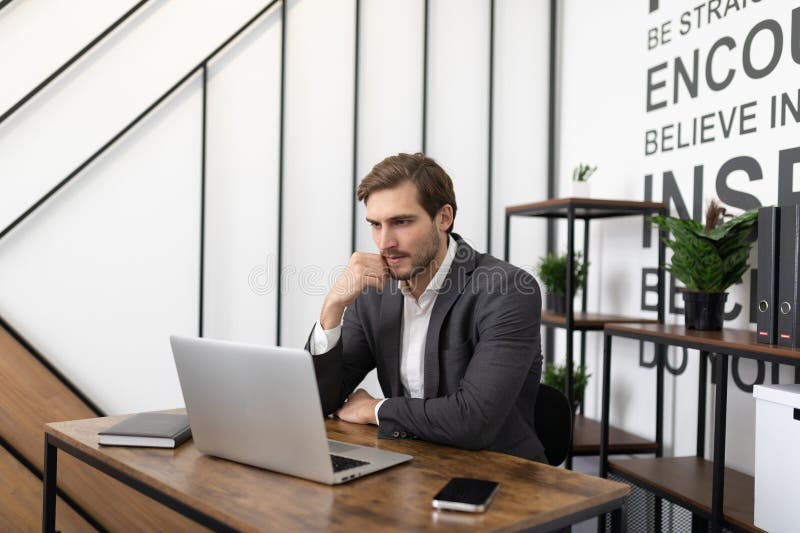 Office Worker Man in a Jacket Sitting at Work at a Laptop Stock Image ...