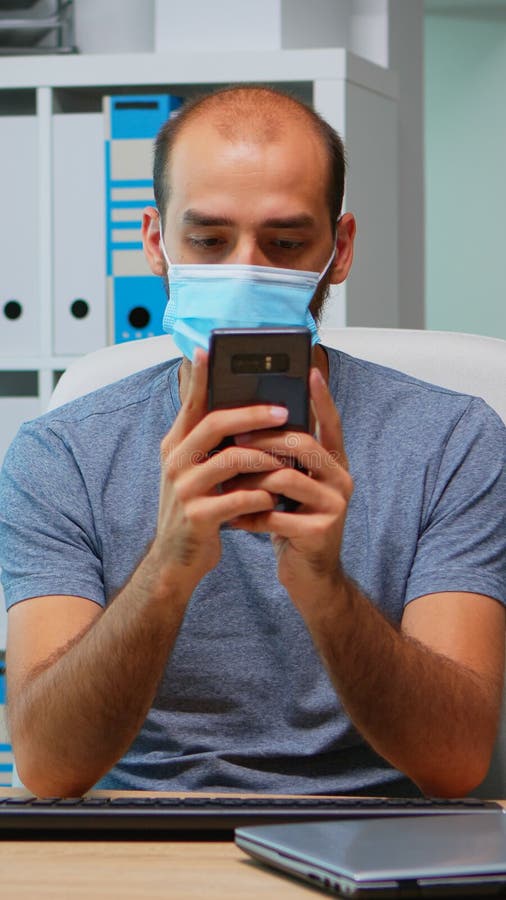 Office Worker with Mask Using Phone Stock Photo - Image of business ...