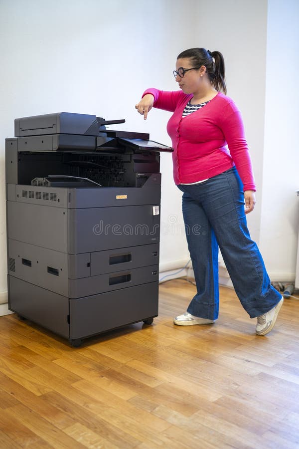 Frustrated Professional Gesturing Toward Opened Printer, Struggling ...