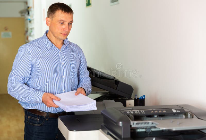 Office Worker Puts a Stack of Paper in the Printer Stock Photo - Image ...
