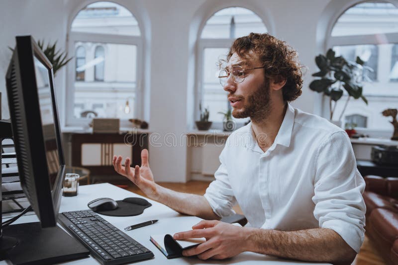 Office Worker Raging on Computer Sitting at Table in Modern Office ...