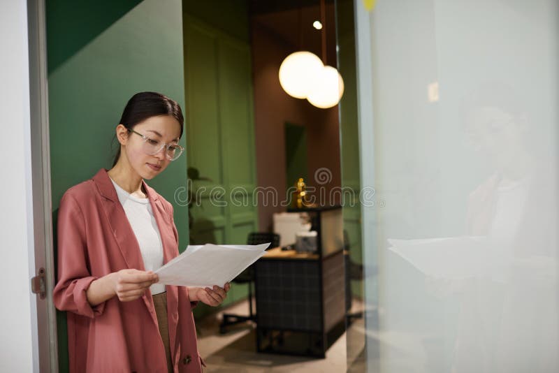 Office Worker Reading Documents Stock Image - Image of adult, holding ...