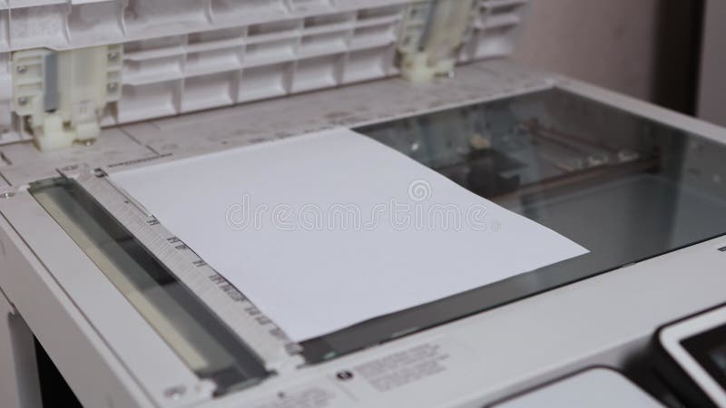 An Office Worker Scans a Sheet of A4 Paper on a Scanner Stock Video ...