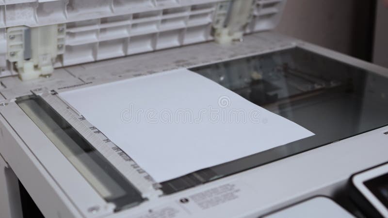 An Office Worker Scans a Sheet of A4 Paper on a Scanner Stock Video ...