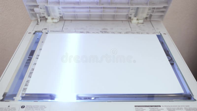 An Office Worker Scans a Sheet of A3 Paper on a Scanner Stock Video ...