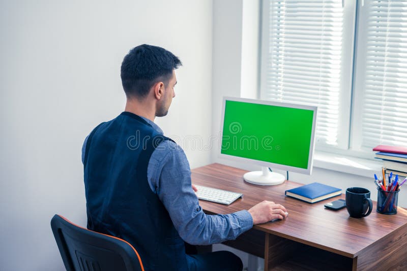 Office Worker Sitting at Computer with Chromakey on Monitor Stock Photo ...