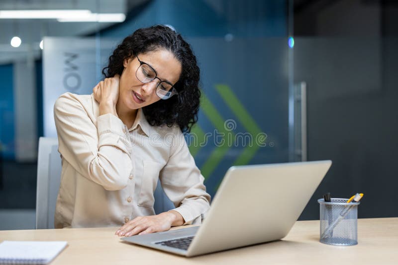 Office Worker Experiencing Neck Pain while Using Laptop in Modern ...