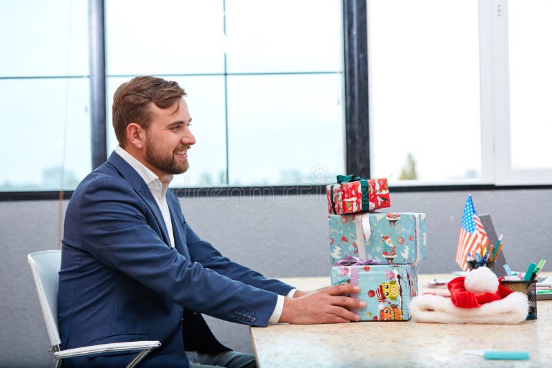 Office Worker Sitting with Gifts at the Table Stock Photo - Image of ...