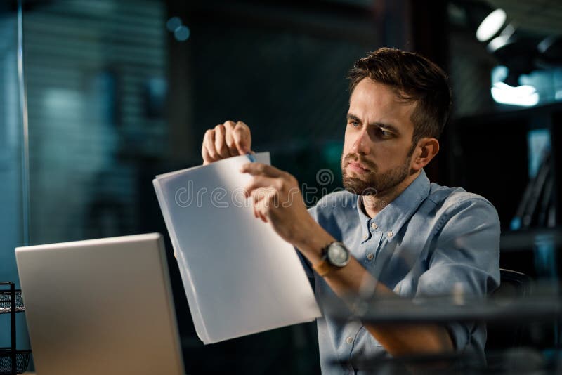 Concentrated Man Stapling Papers Stock Photo - Image of intelligent ...