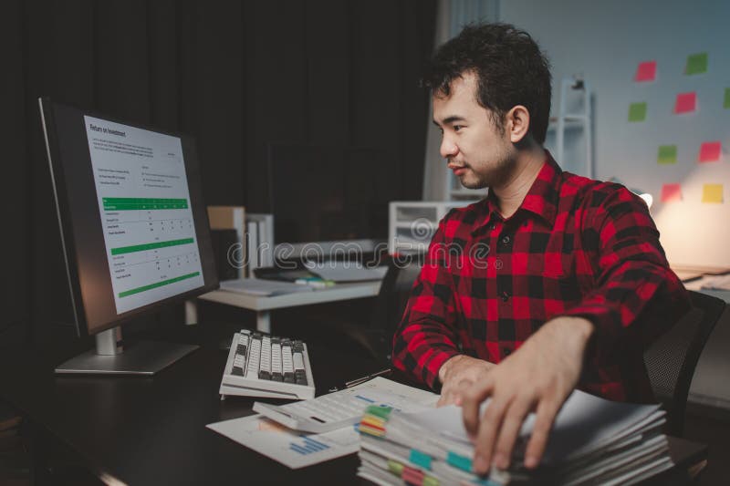 Office Worker with Stacks of Documents, he is a Startup Company ...