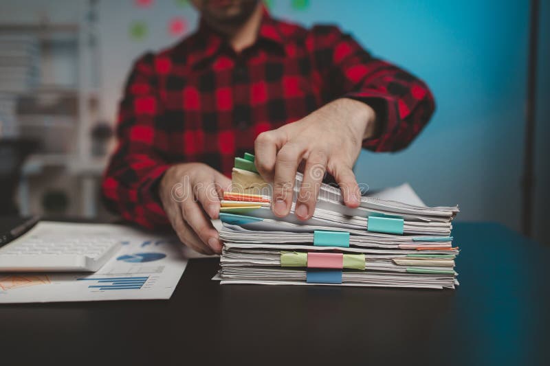 Office Worker with Stacks of Documents, he is a Startup Company ...