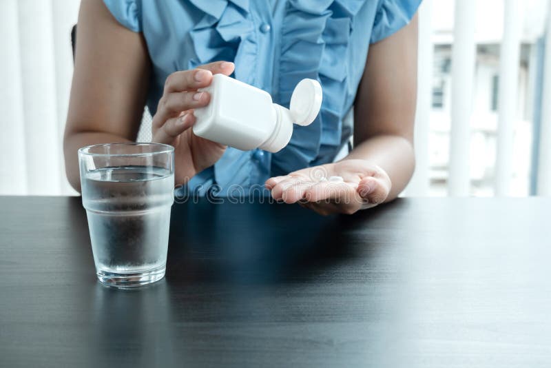 The Office Worker Takes Medication To Cure Headaches and Rest at Her ...