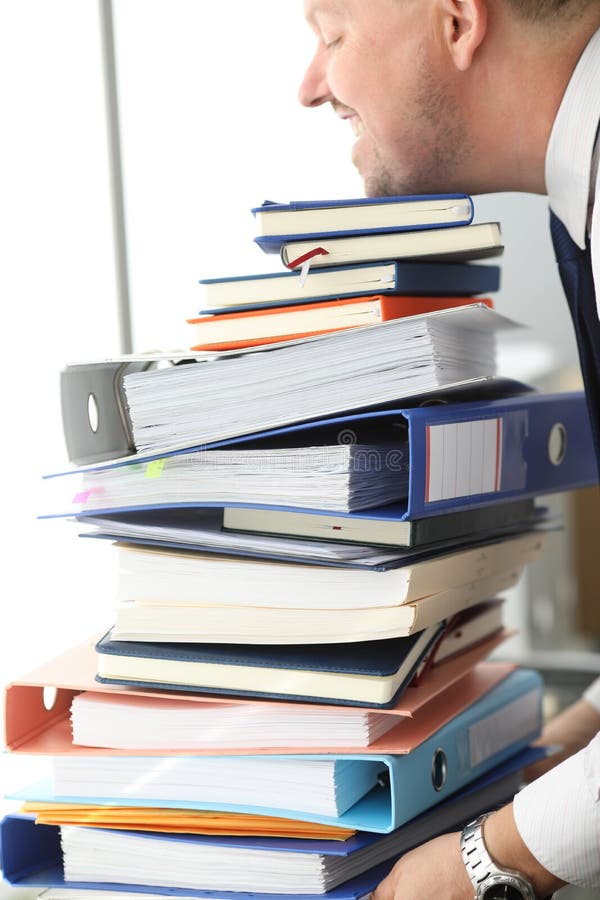 Office Worker Trying To Lift Huge Pile of Documents Stock Image - Image ...