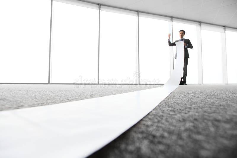Office Worker Unrolling Long Sheet Stock Photo - Image of concept ...