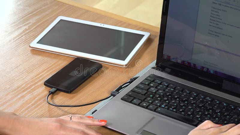 Smart Phones Charging on Wireless Charger and with Usb Cable Stock ...
