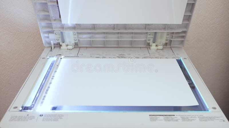 An Office Worker Scans a Sheet of A3 Paper on a Scanner Stock Video ...