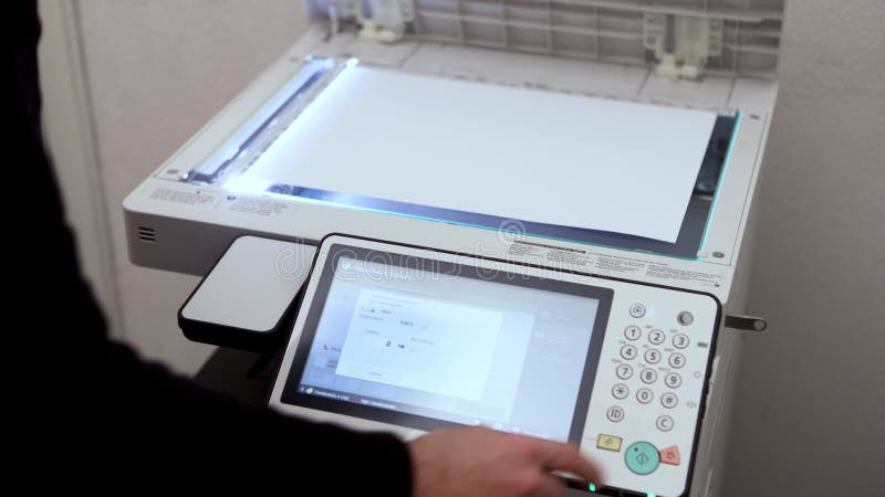 An Office Worker Scans a Sheet of A3 Paper on a Scanner Stock Video ...