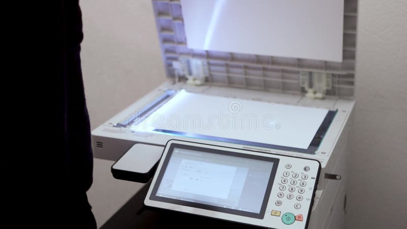 An Office Worker Scans a Sheet of A3 Paper on a Scanner Stock Footage ...