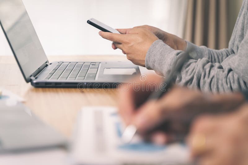 Worker Using His Mobile Phone in the Office. Business Concept Stock ...