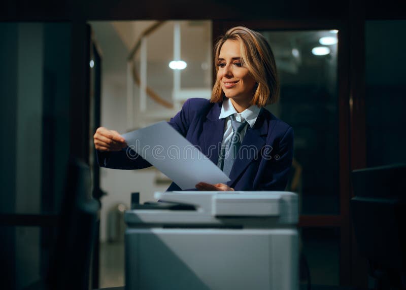 Office Worker Using the Printer To Print Documents at Work Stock Image ...