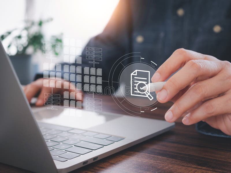 Office Worker Using Stylus Pen To Search for Documents from the Laptop ...