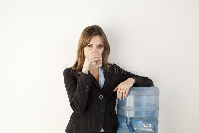 Business People Interacting at a Water Cooler Stock Image - Image of ...