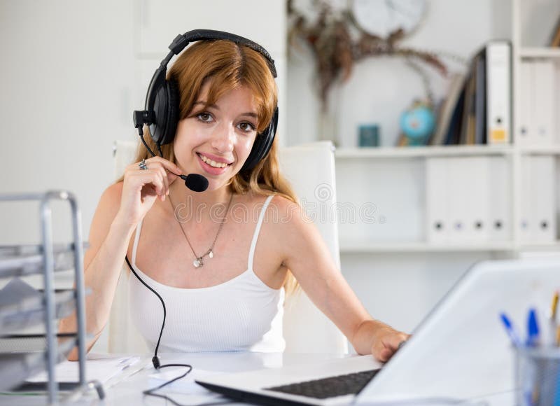Office Worker Woman is Working at a Computer and Talking by Headset ...