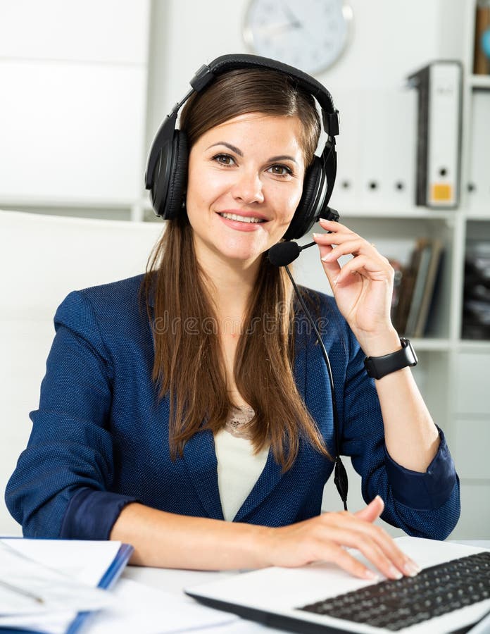 Office Worker Woman is Working at a Computer and Talking by Headset ...